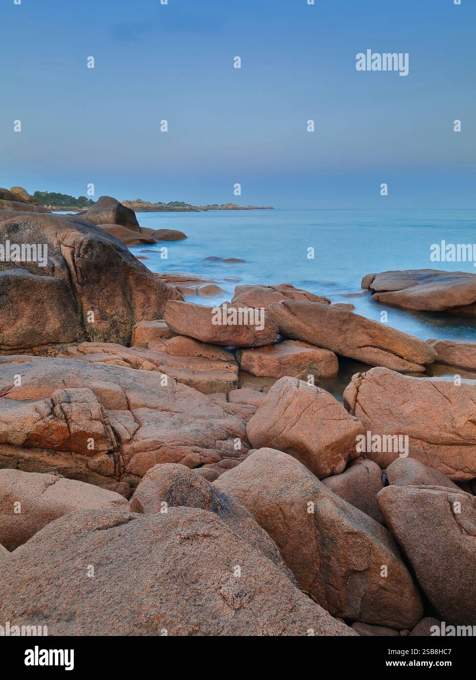 View along the Pink Granite Coast -chaos of stacked rock block heaps of ...