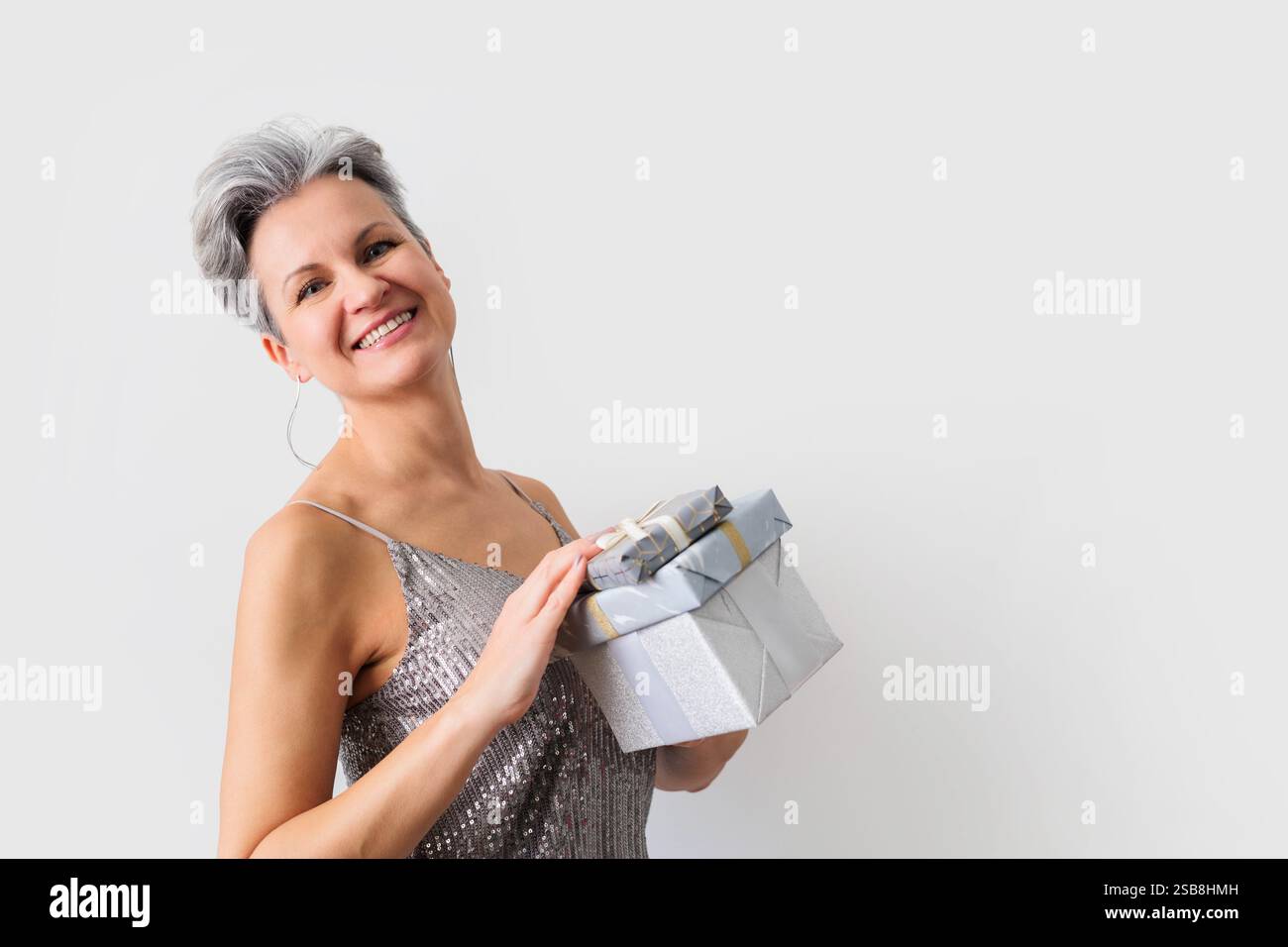 Smiling happy lady 50 years old with gray hair and short haircut ...