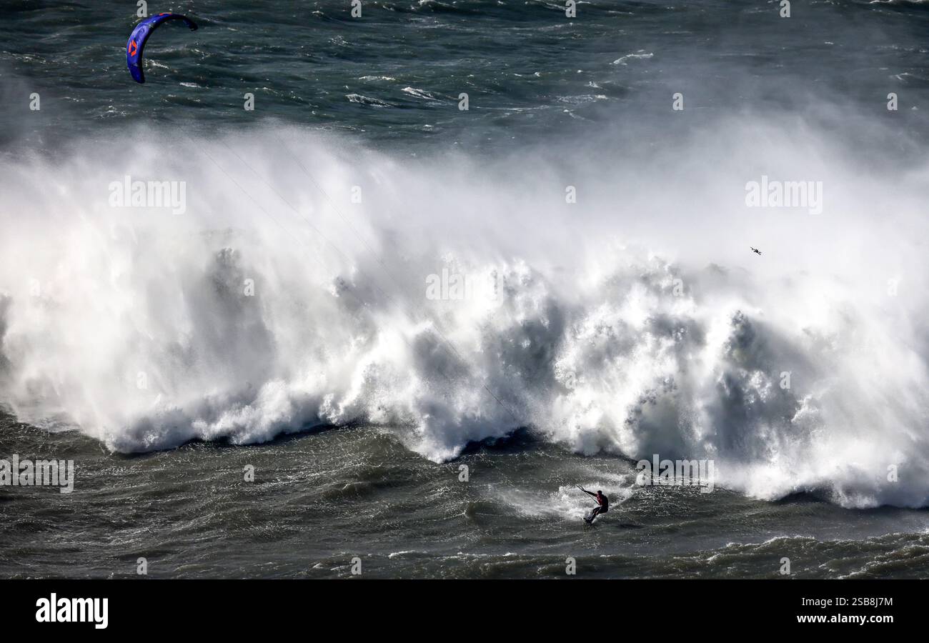 NAZARE, PORTUGAL - JANUARY 30: James Carew of Australia is kitesurfing ...