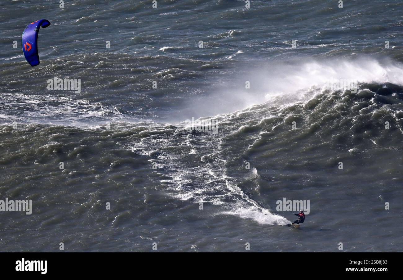 NAZARE, PORTUGAL - JANUARY 30: James Carew of Australia is kitesurfing ...
