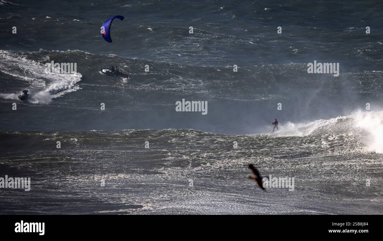 NAZARE, PORTUGAL - JANUARY 30: James Carew of Australia is kitesurfing ...