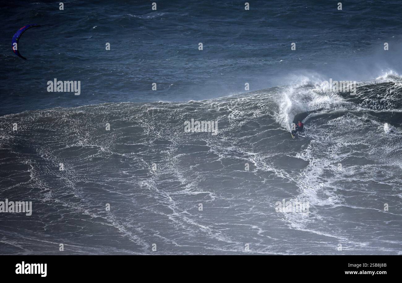 NAZARE, PORTUGAL - JANUARY 30: James Carew of Australia is kitesurfing ...