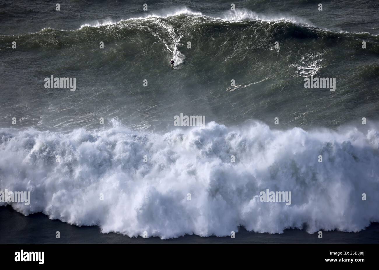 NAZARE, PORTUGAL - JANUARY 28: James Carew of Australia riding a big ...
