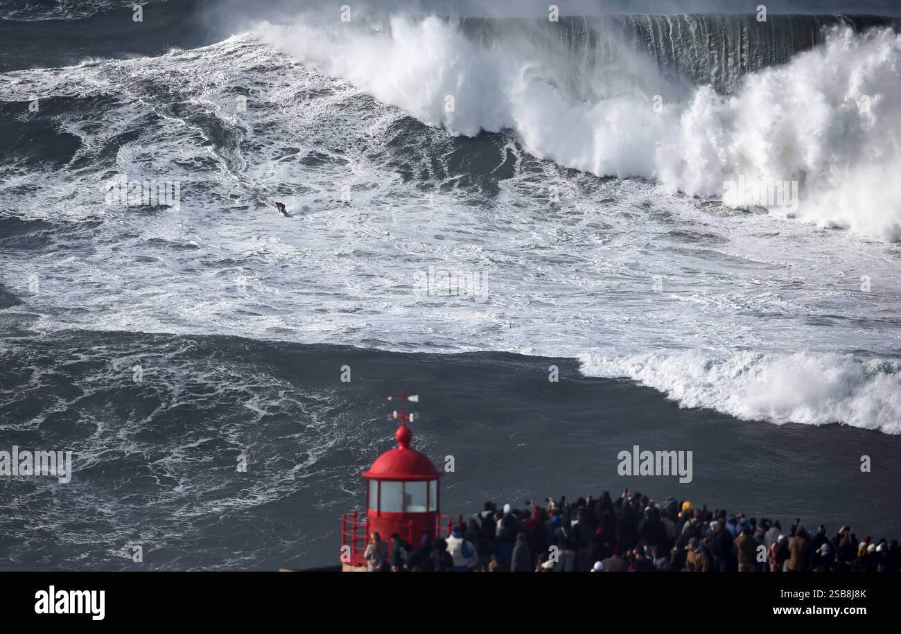 NAZARE, PORTUGAL - JANUARY 28: James Carew of Australia riding a big ...