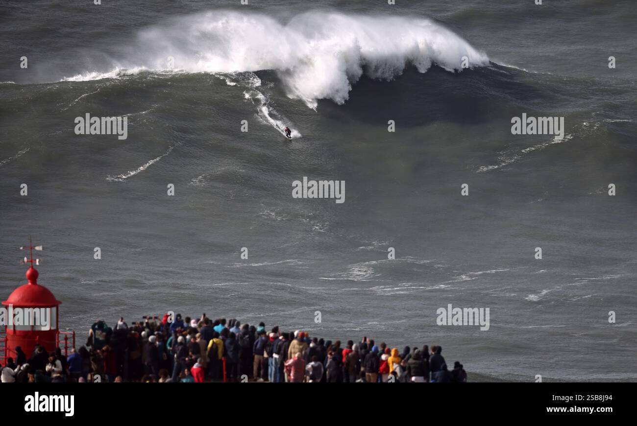 NAZARE, PORTUGAL - JANUARY 28: James Carew of Australia riding a big ...