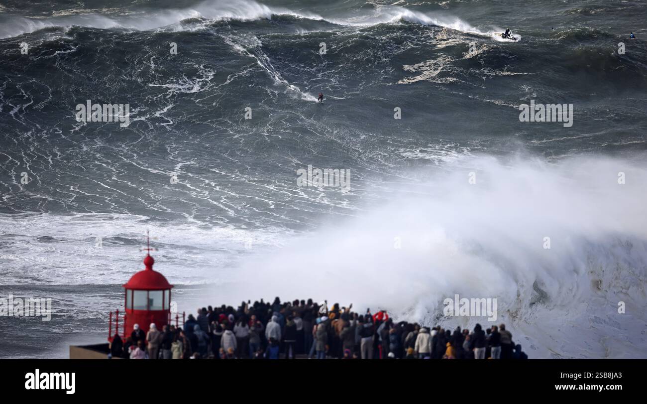 NAZARE, PORTUGAL - JANUARY 28: James Carew of Australia riding a big ...