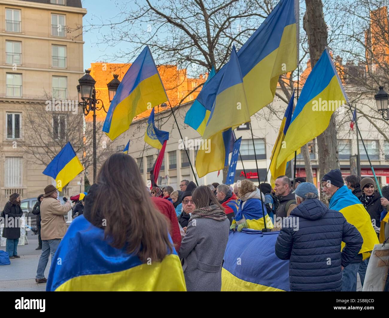 Flags wave in unity, symbolizing hope and resilience in the crowd Stock ...