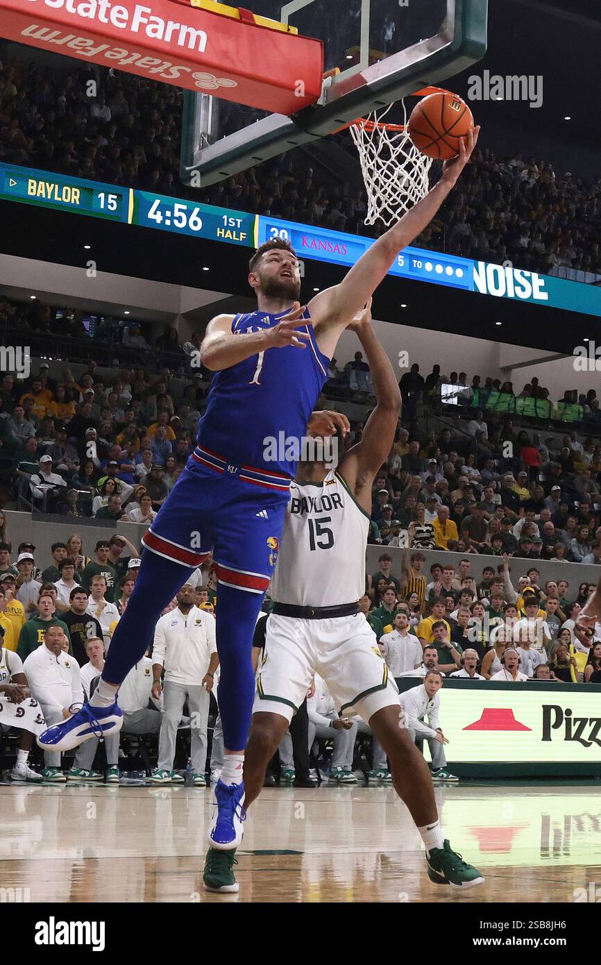 Kansas center Hunter Dickinson attempts a shot past Baylor forward ...