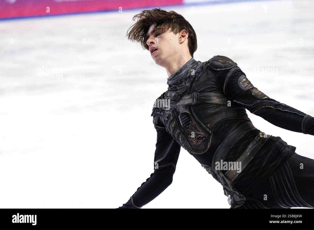 Mikhail Shaidorov of Kazakhstan in action during the Men Single Skating ...