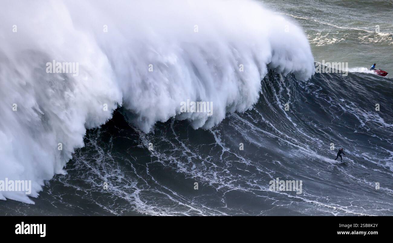 NAZARE, PORTUGAL - JANUARY 28: Will Santana of Brasil riding a big wave ...