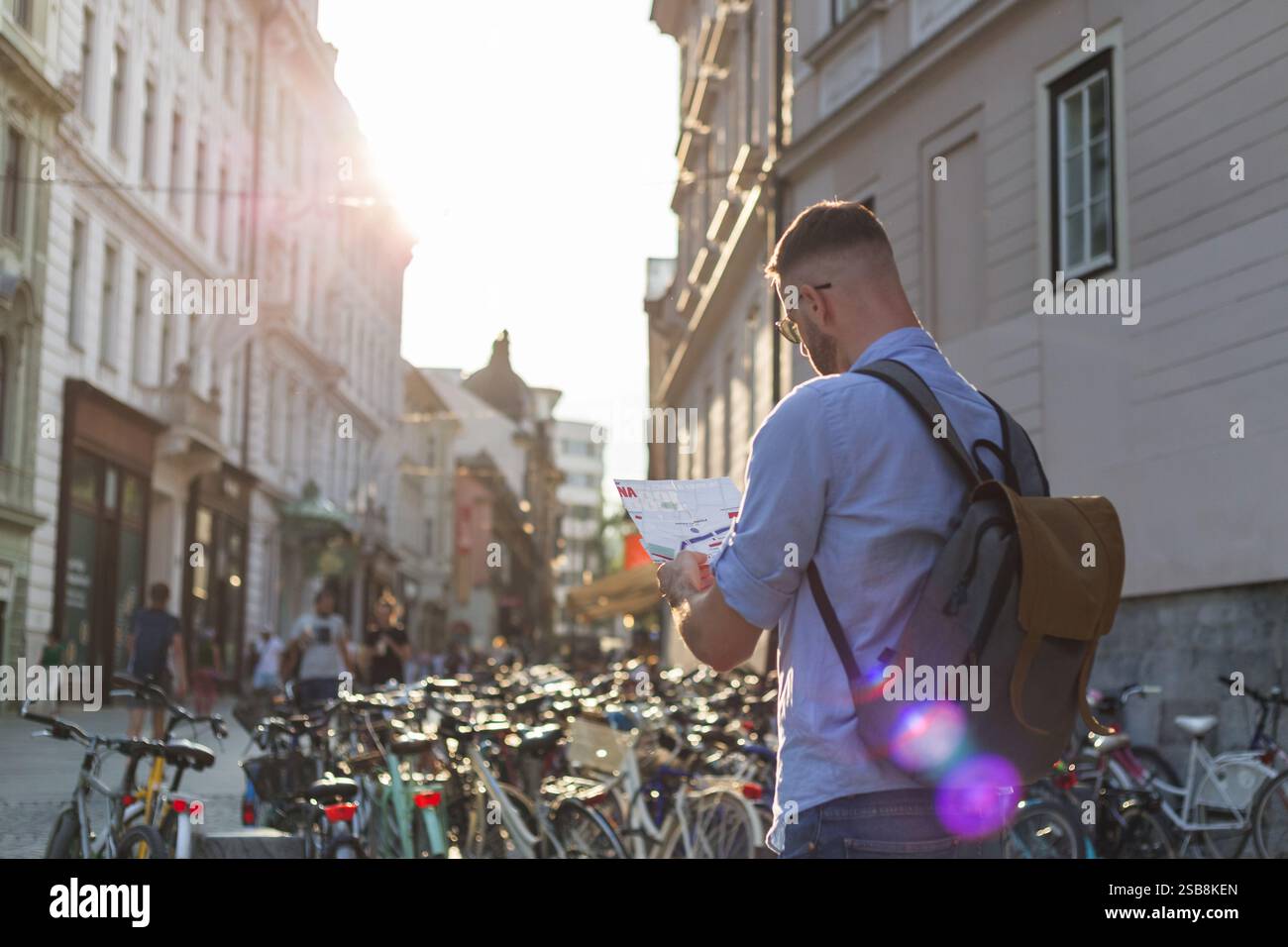 On his summer journey, the young man standing at the city square ...