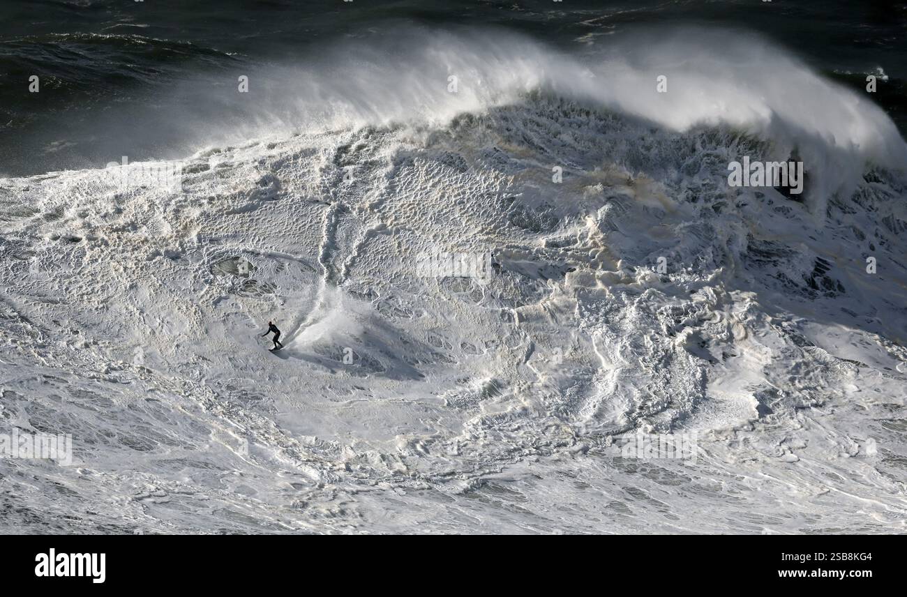 NAZARE, PORTUGAL - JANUARY 28: Will Santana of Brasil surfing big waves ...
