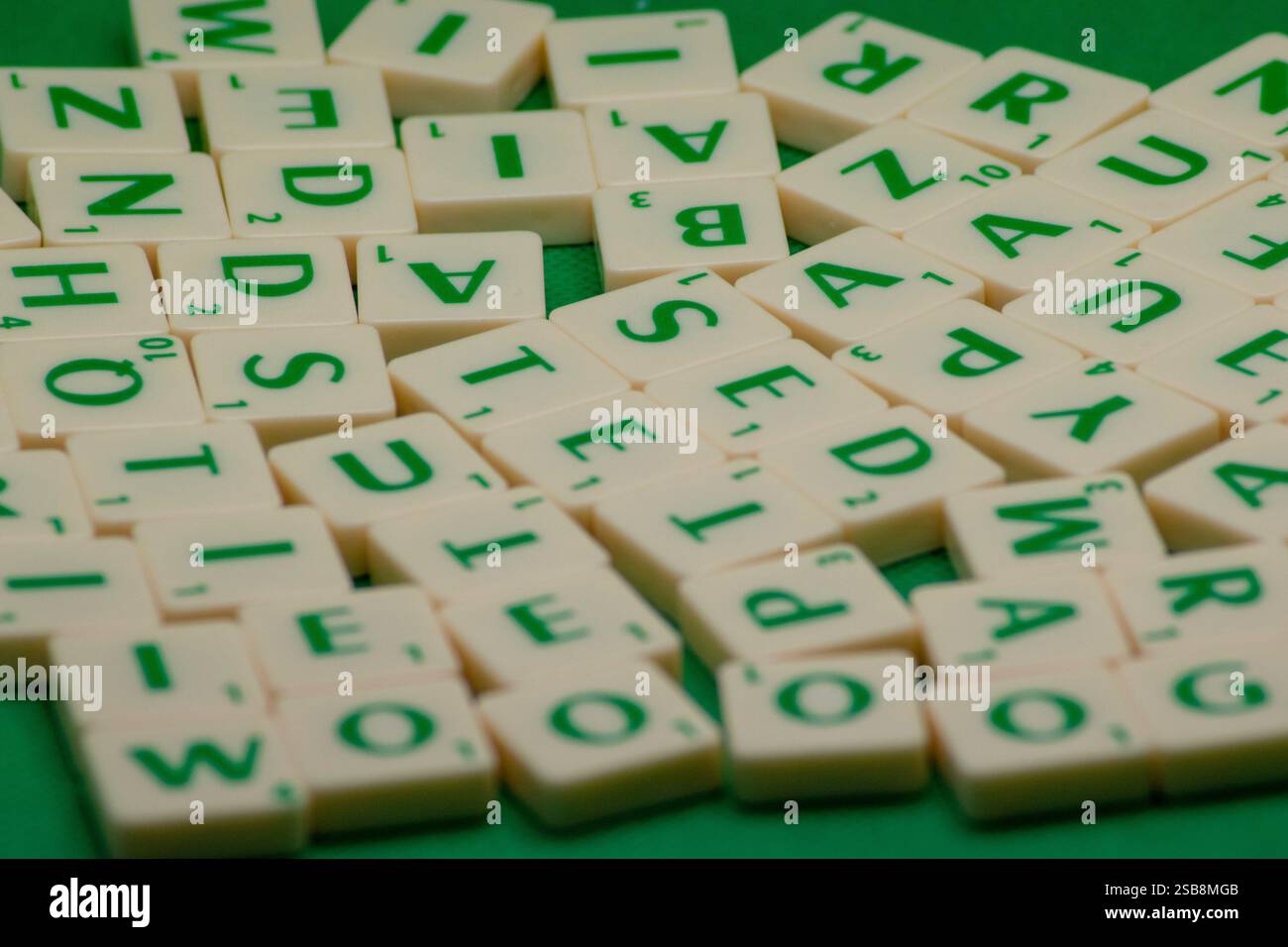 Photograph, a group of scrabble capital letters with green color Stock ...