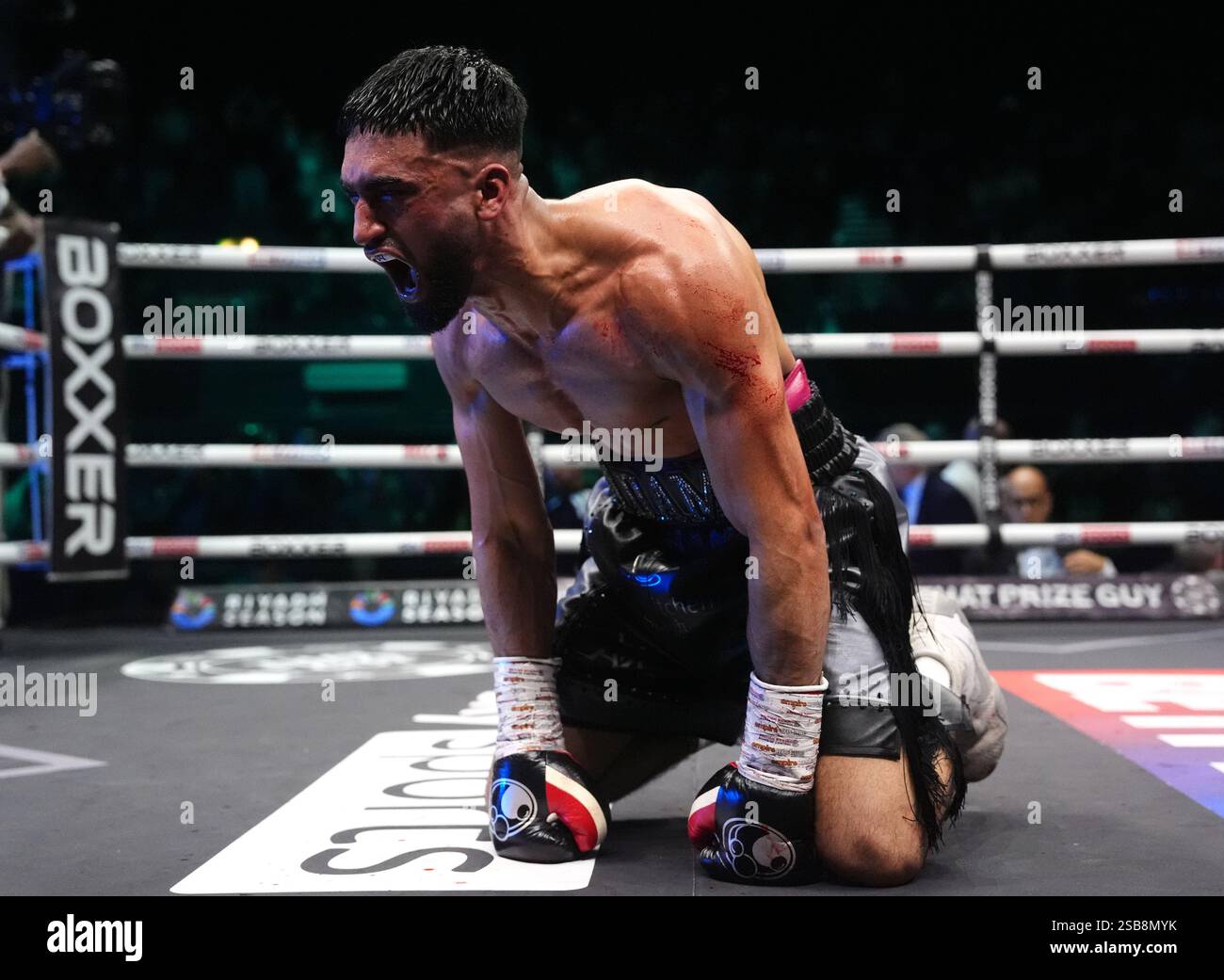 Adam Azim celebrates victory against Sergey Lipinets (not pictured ...