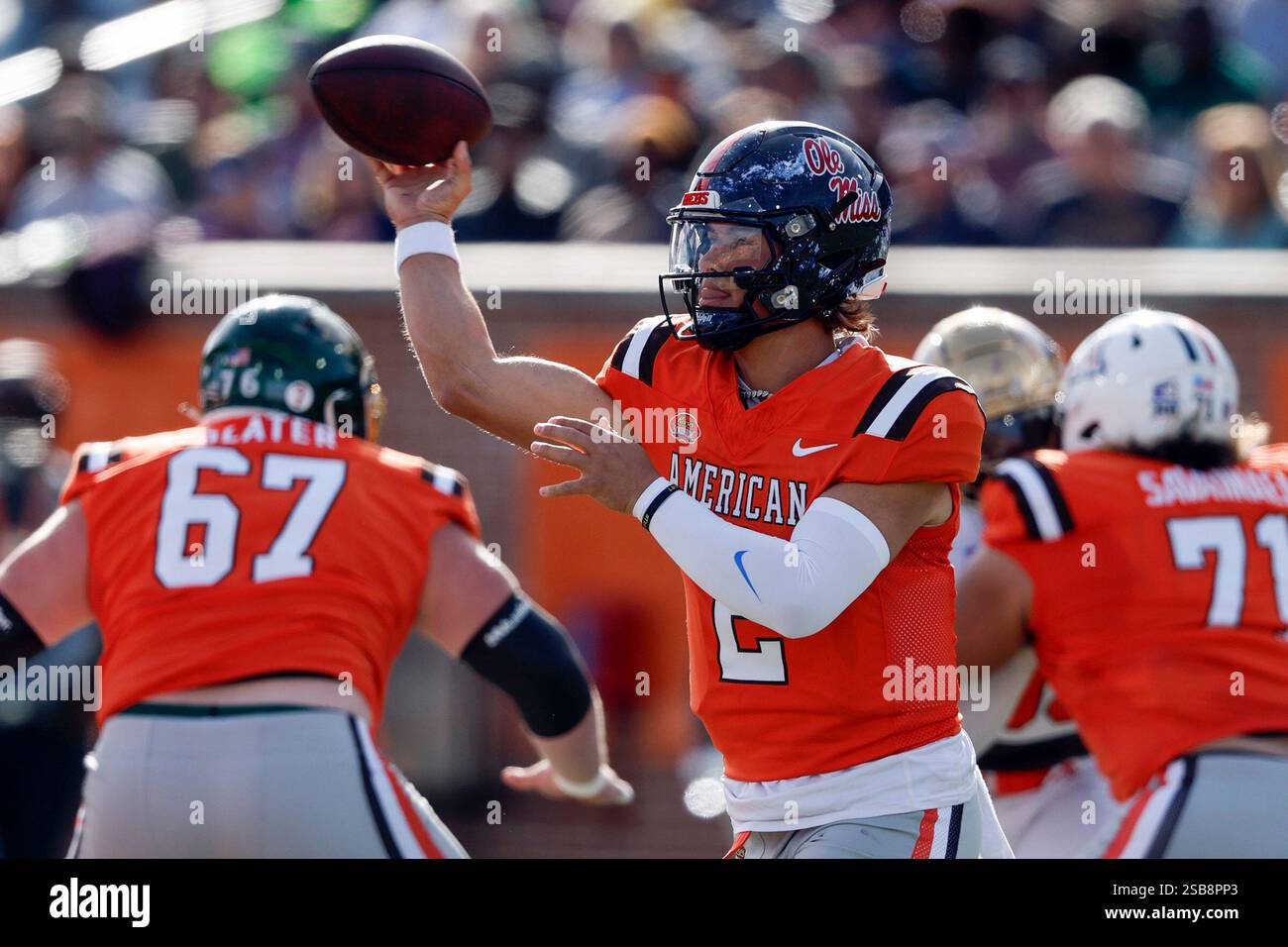 American team quarterback Jaxson Dart, center, of Mississippi, throws a ...