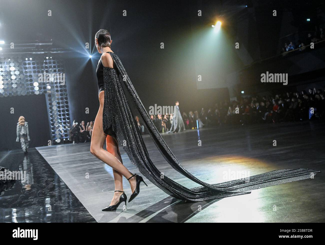 Berlin, Germany. 31st Jan, 2025. A model shows a creation by designer ...