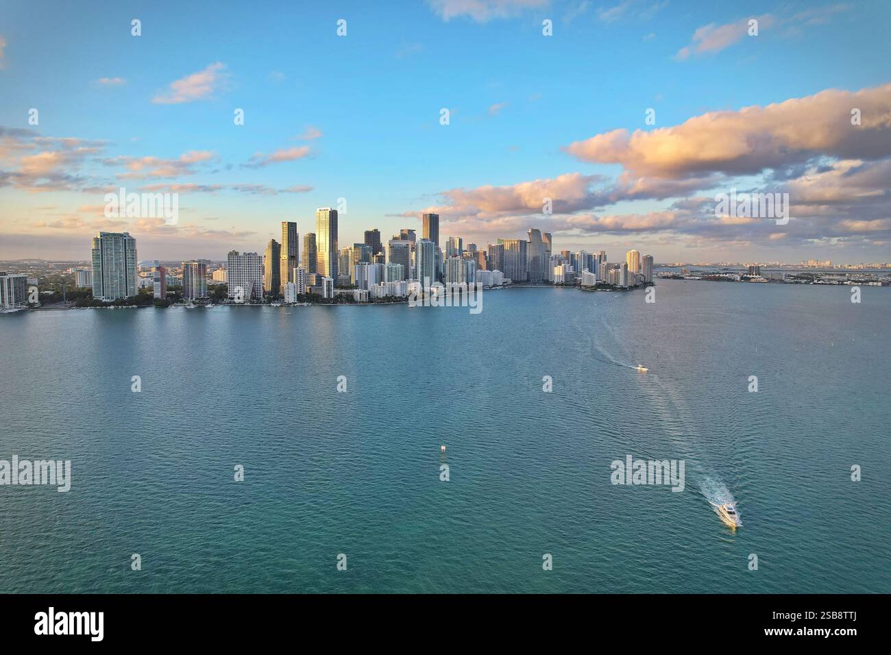 Aerial view of the Miami skyline at sunset from Biscayne Bay. Miami ...