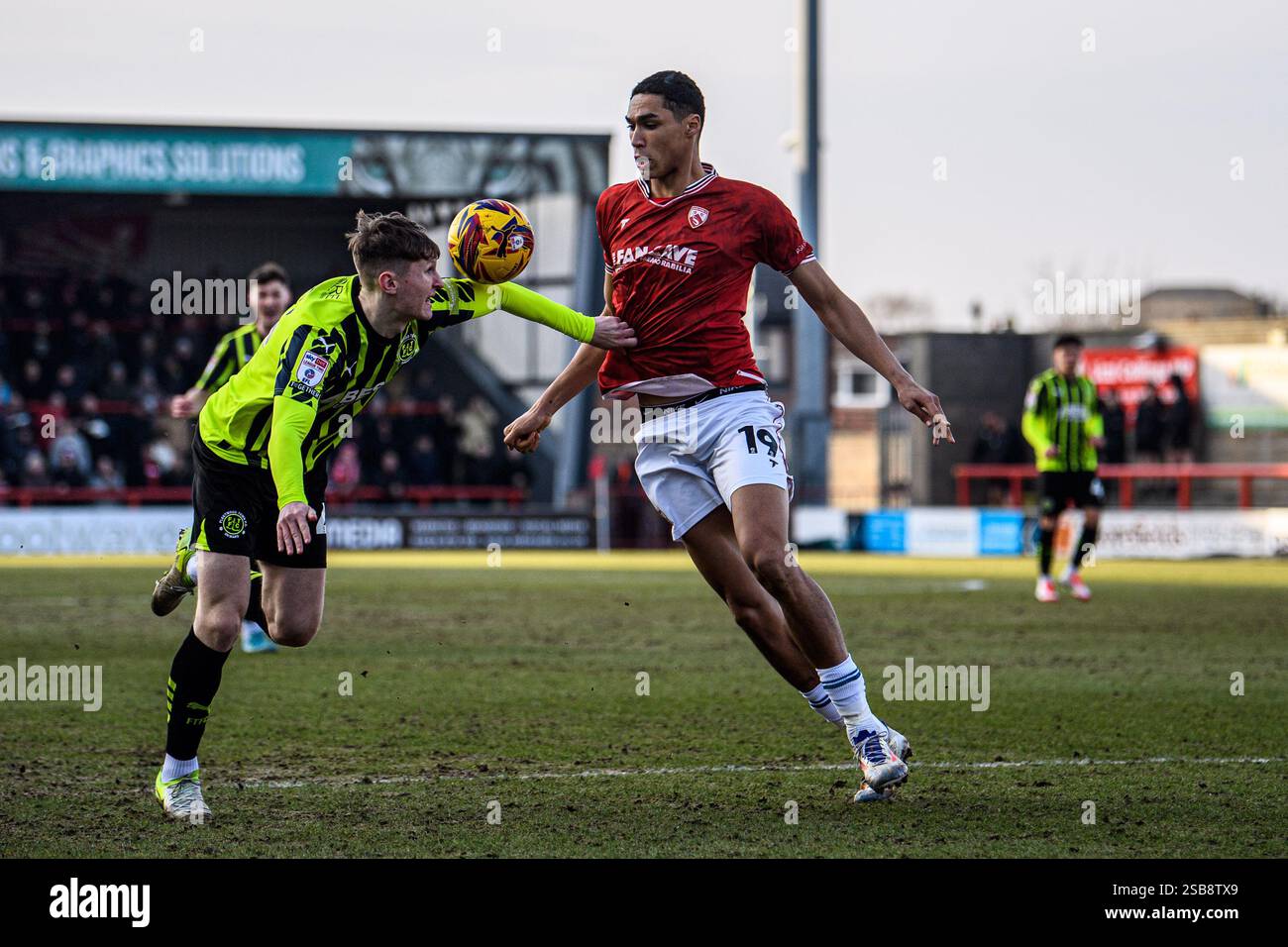 Morecambe, UK. 1st Feb 2025. Finley Potter of Fleetwood Town FC tangles ...