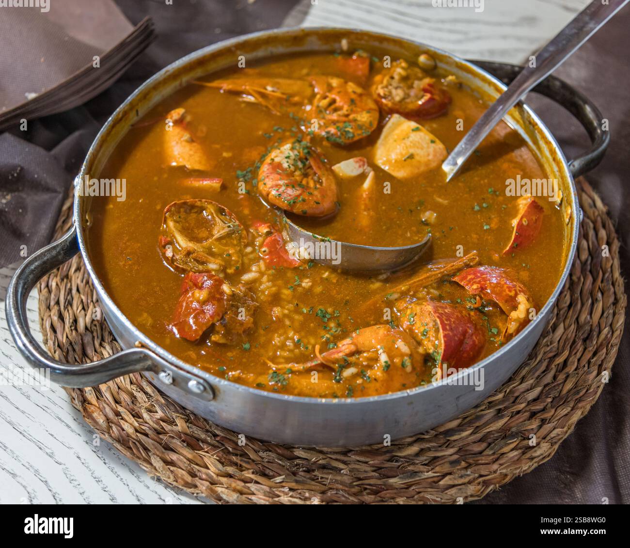 A dish of lobster brothy rice (arroz caldoso), typical of Spanish ...