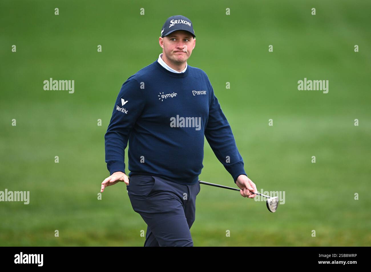 Sepp Straka, of Austria, waves on the 17th hole at Pebble Beach Golf ...