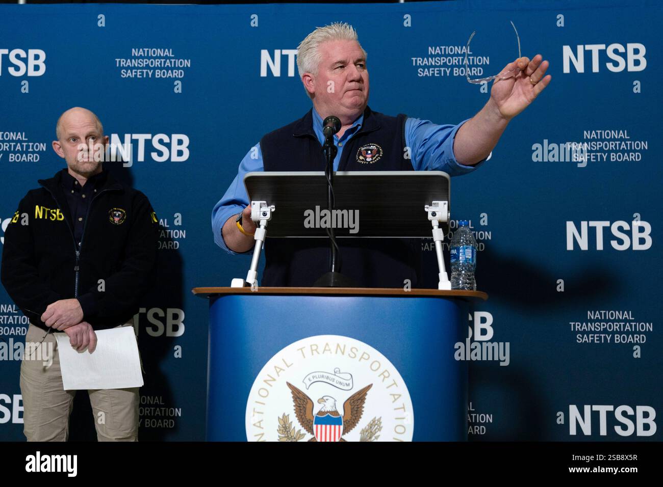 National Transportation Safety Board member Todd Inman, center, speaks ...