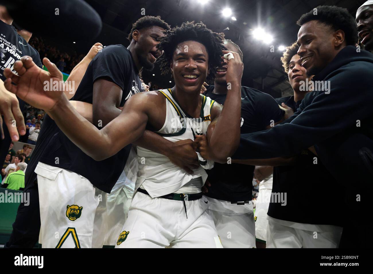 Baylor guard Robert Wright III, center, is mobbed by teammates after ...