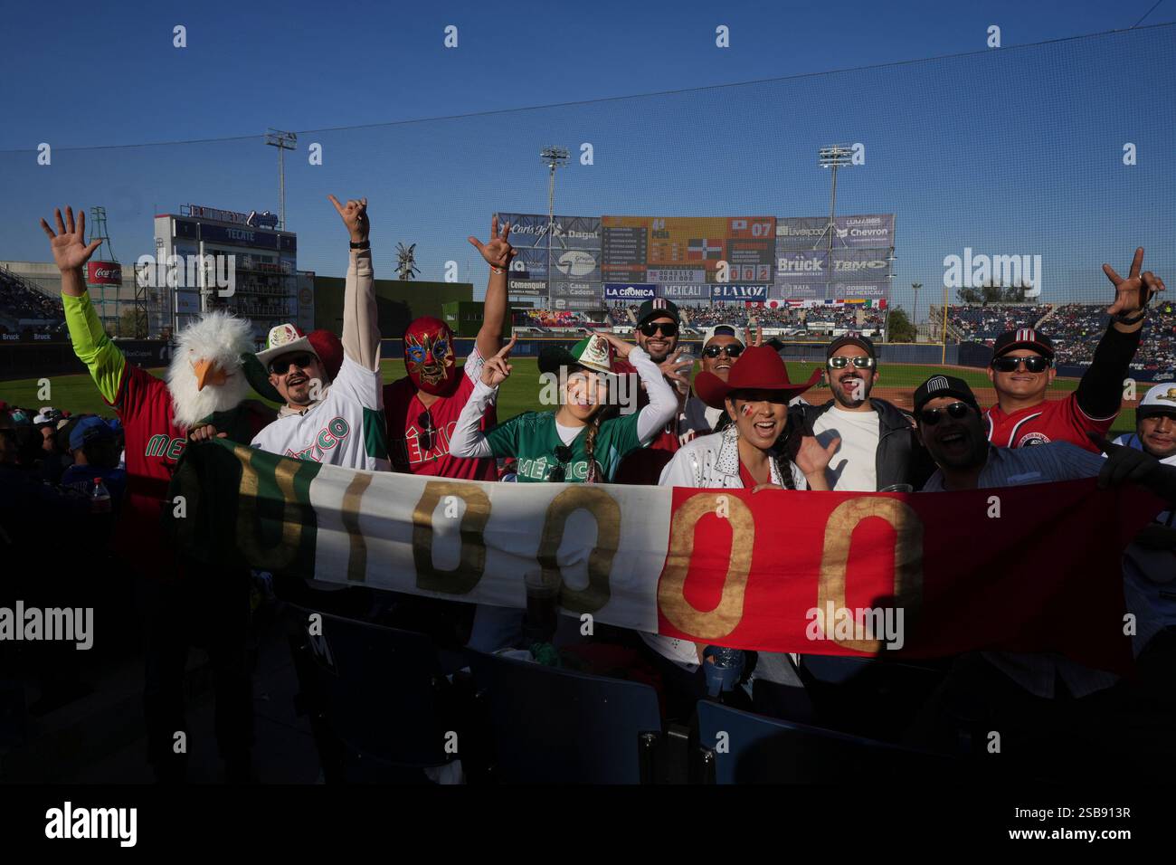 Mexican fans get revved up as they wait for the start of a Caribbean ...