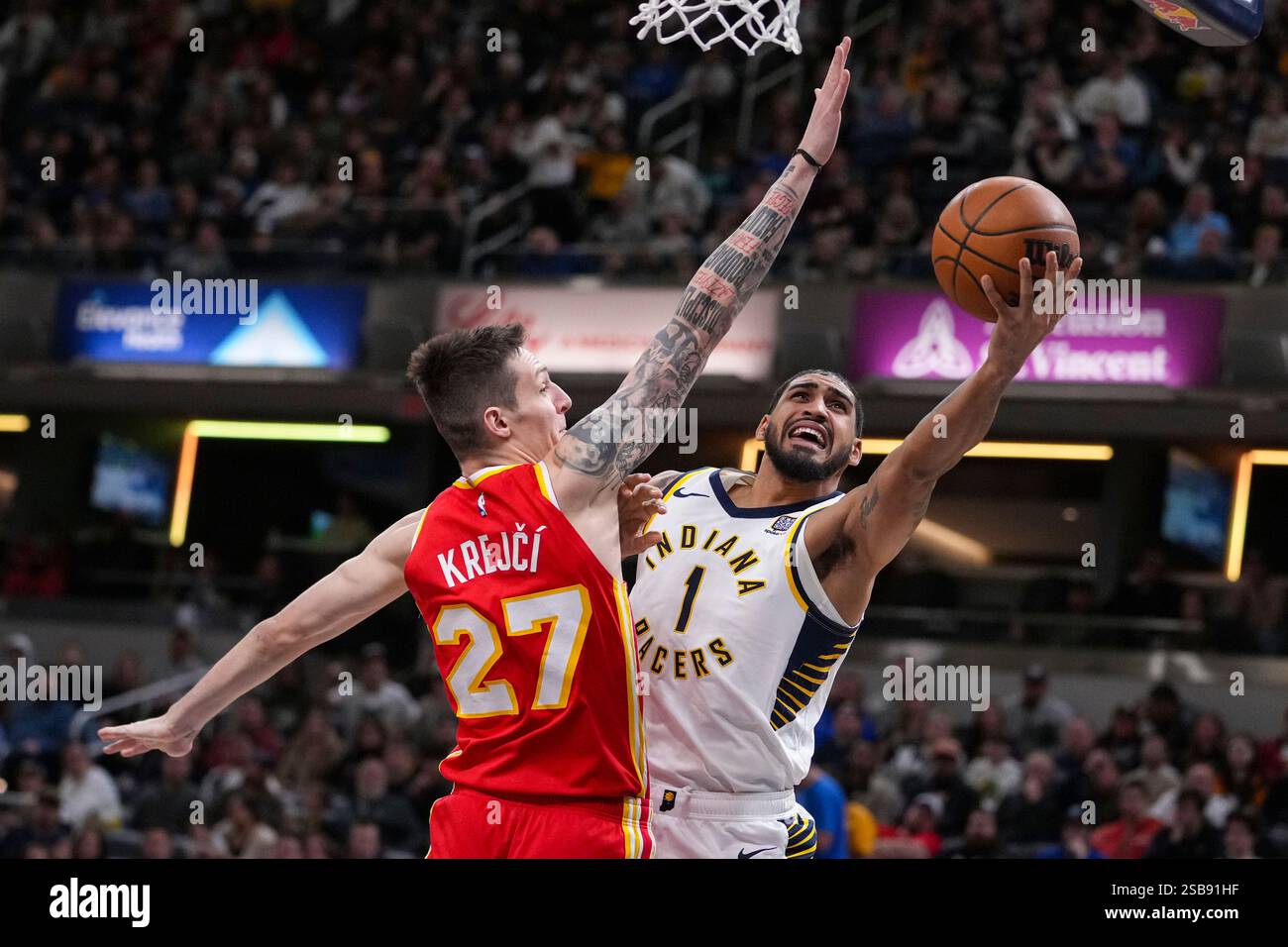 Indiana Pacers forward Obi Toppin (1) shoots around Atlanta Hawks guard ...