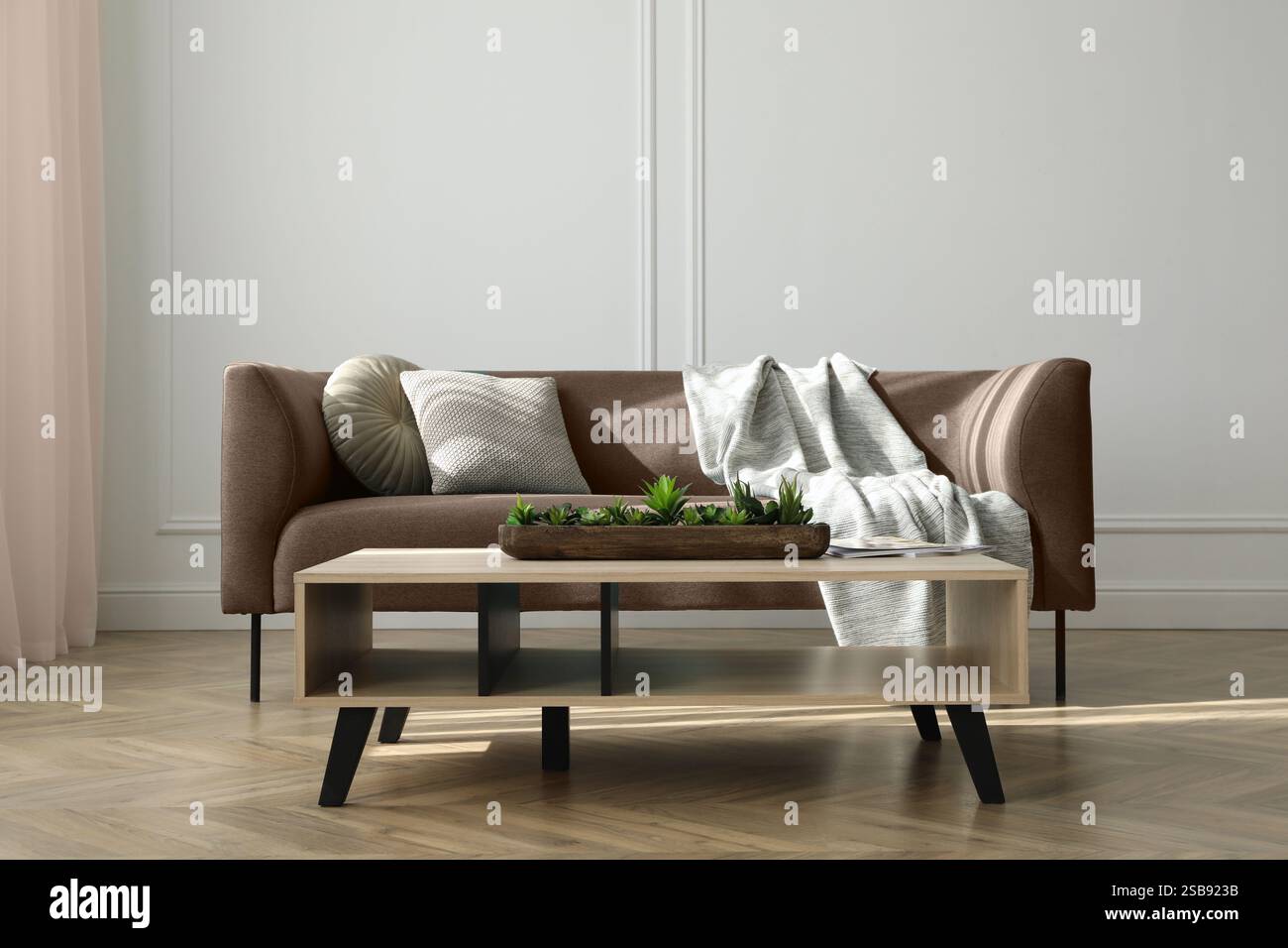 Sofa in mocha mousse shade and table indoors. Cozy living room interior ...