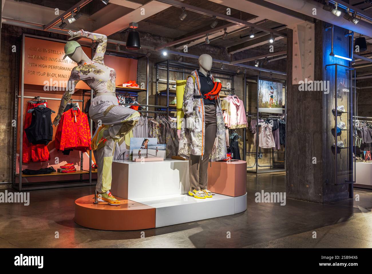 Modern Adidas store interior with stylish mannequins dressed in ...