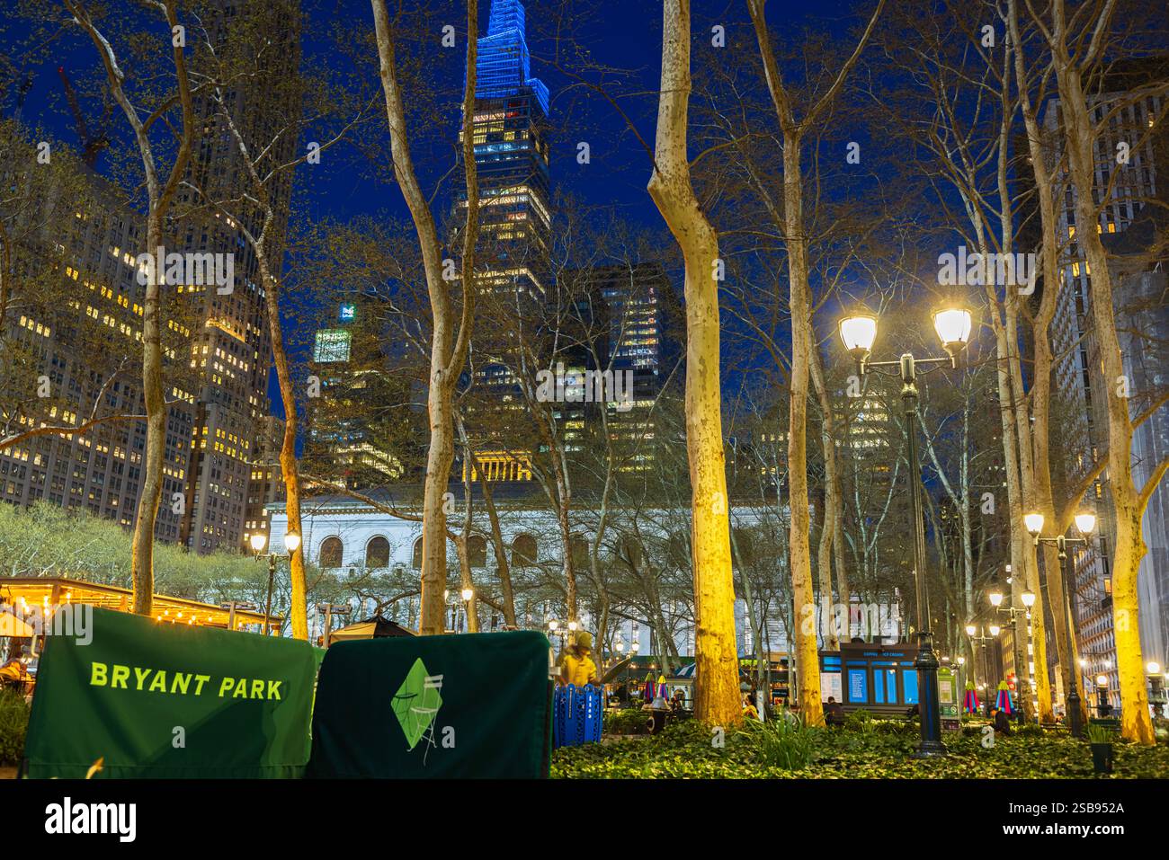 Night view of Bryant Park in New York City with illuminated trees ...