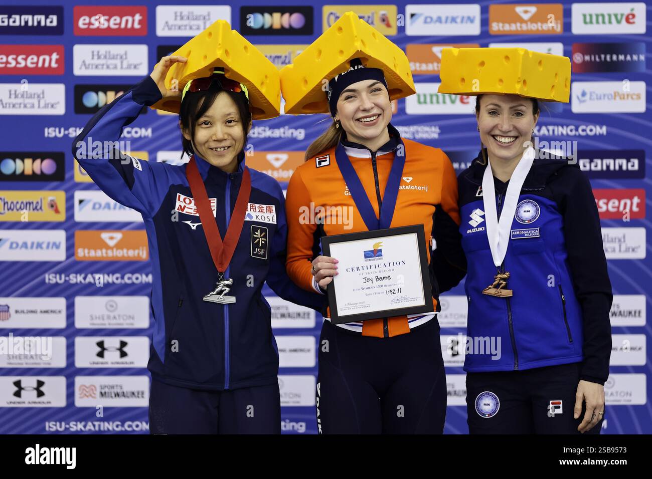 Joy Beune (C) of the Netherlands poses after winning gold in the women ...