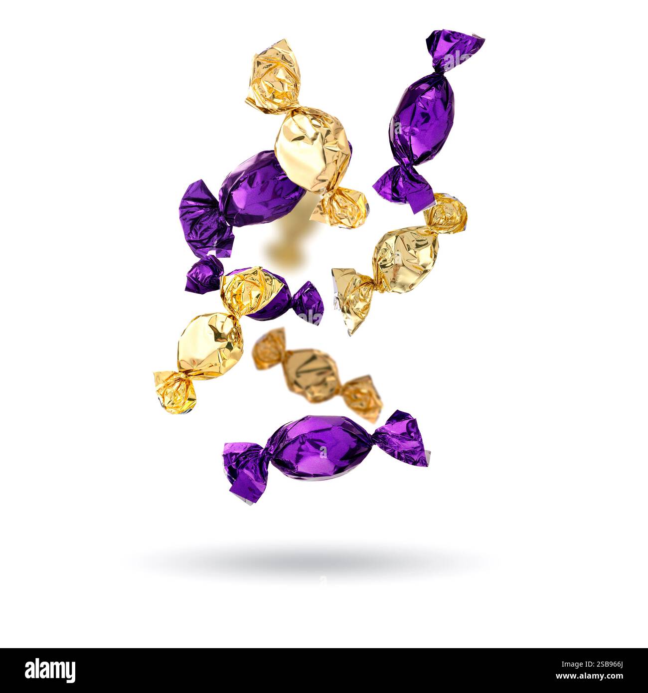 Candies in bright wrappers falling on white background Stock Photo - Alamy
