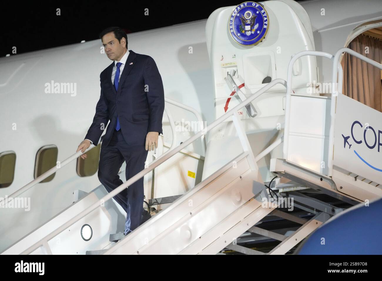 Secretary of State Marco Rubio deplanes at the international airport in ...