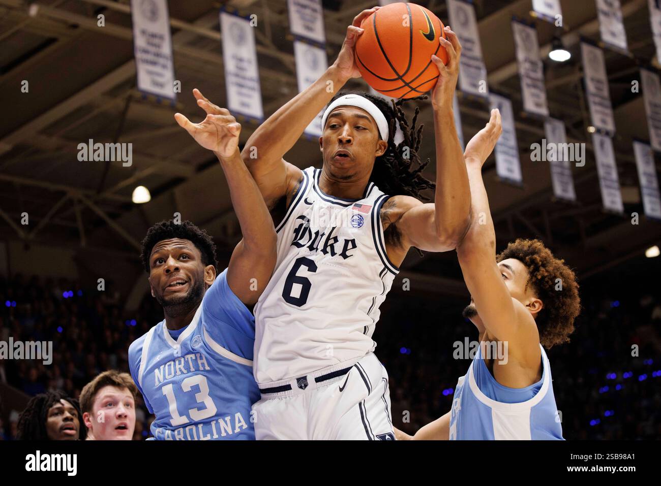Duke's Maliq Brown (6) grabs a rebound between North Carolina's Jalen ...