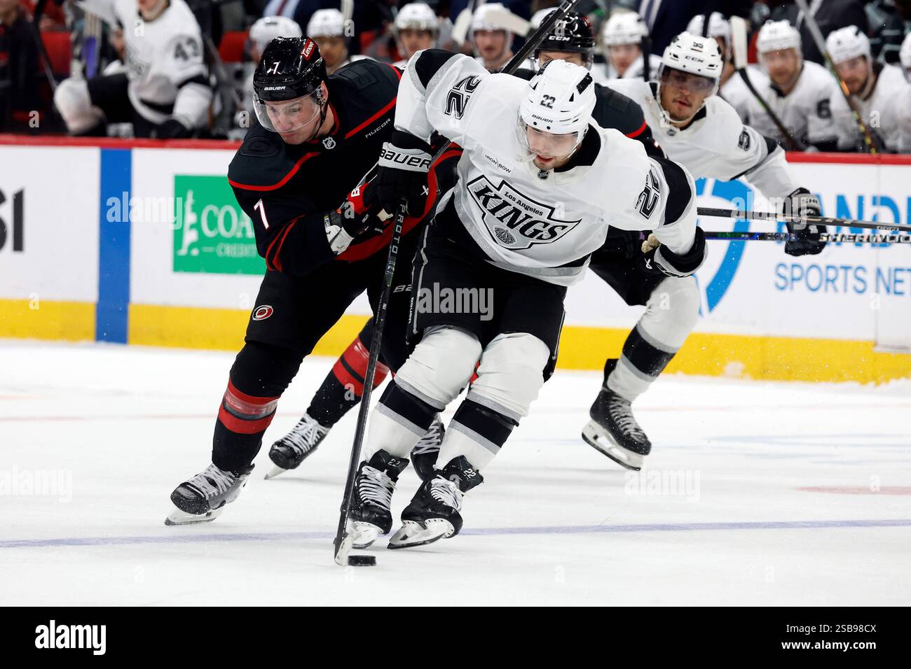 Los Angeles Kings' Kevin Fiala (22) takes the puck away from Carolina ...