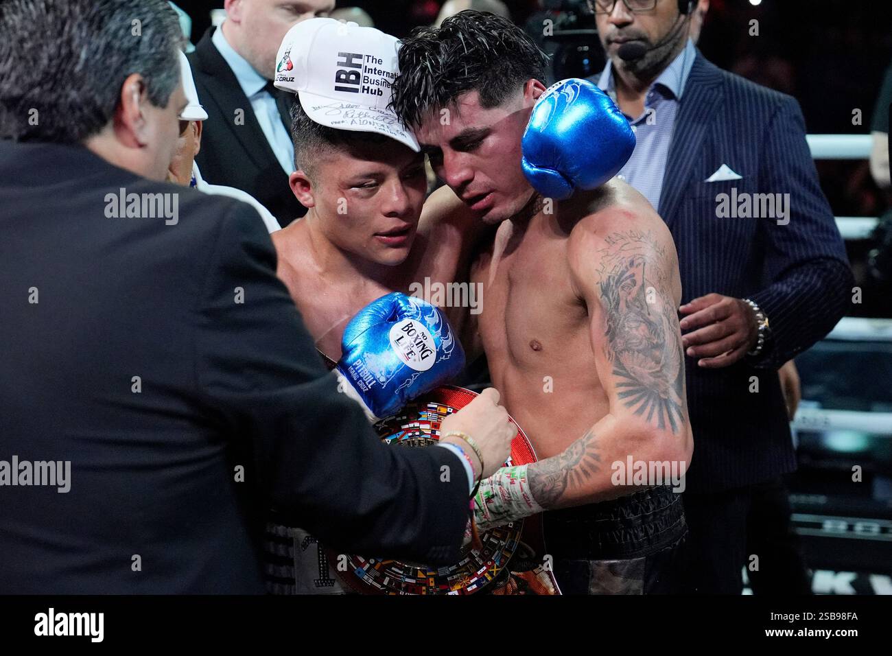 Isaac Cruz, left, embraces Angel Fierro after their super lightweight ...