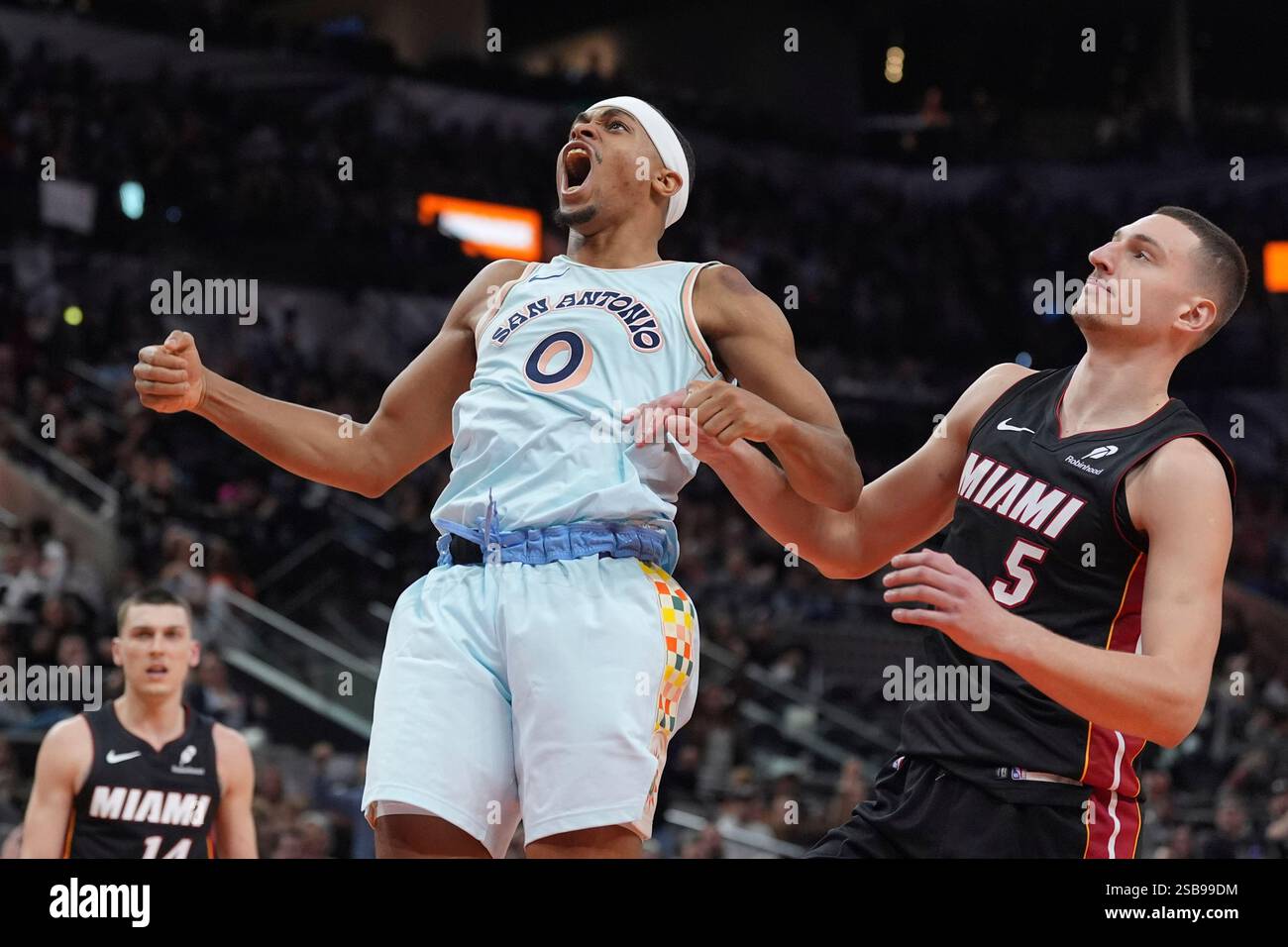 San Antonio Spurs forward Keldon Johnson (0) reacts after scoring over ...