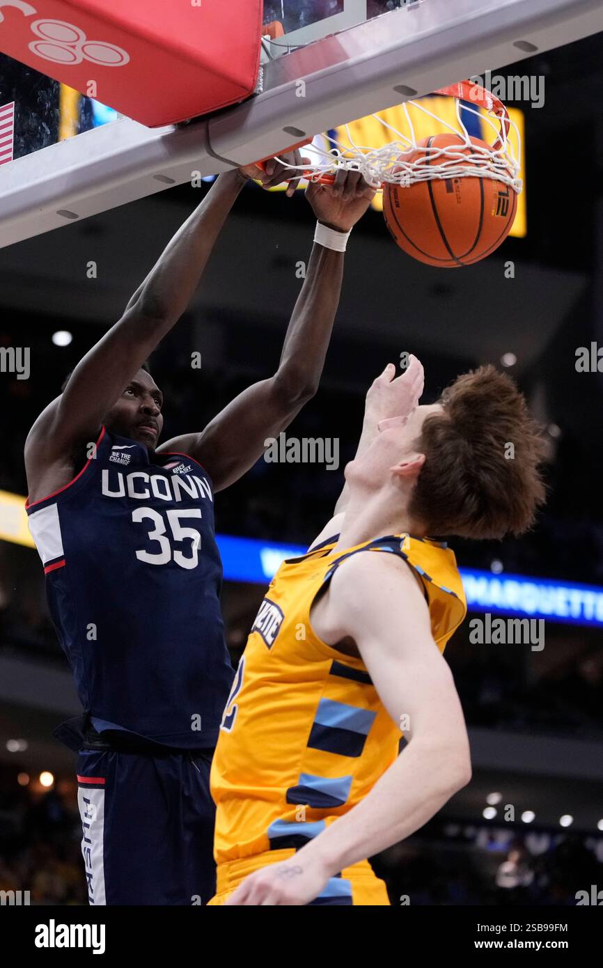 UConn's Samson Johnson dunks over Marquette's Ben Gold during the ...