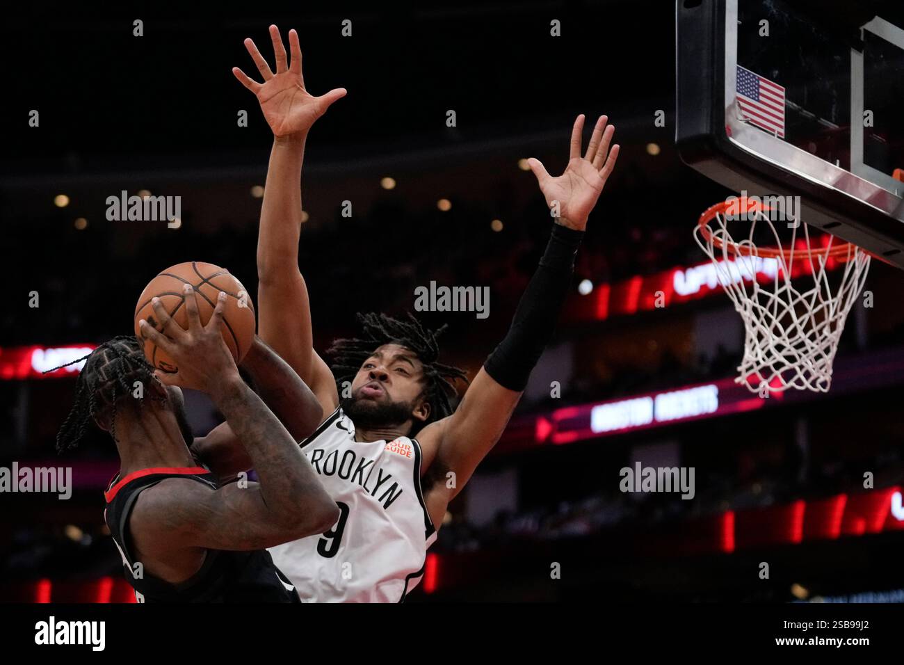 Houston Rockets forward Tari Eason, left, shoots against Brooklyn Nets ...