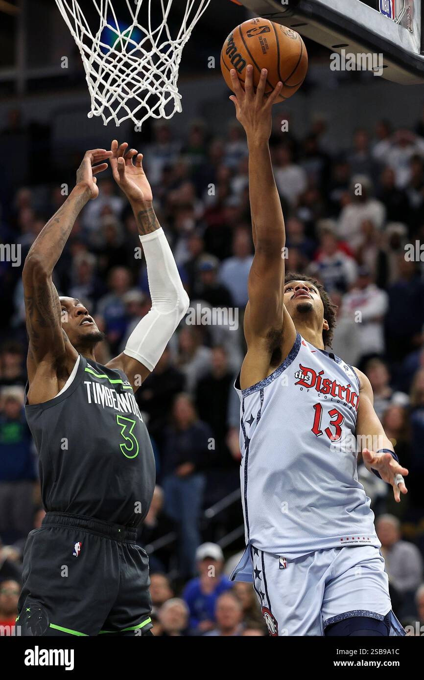 Washington Wizards guard Jordan Poole, right, shoots as Minnesota ...