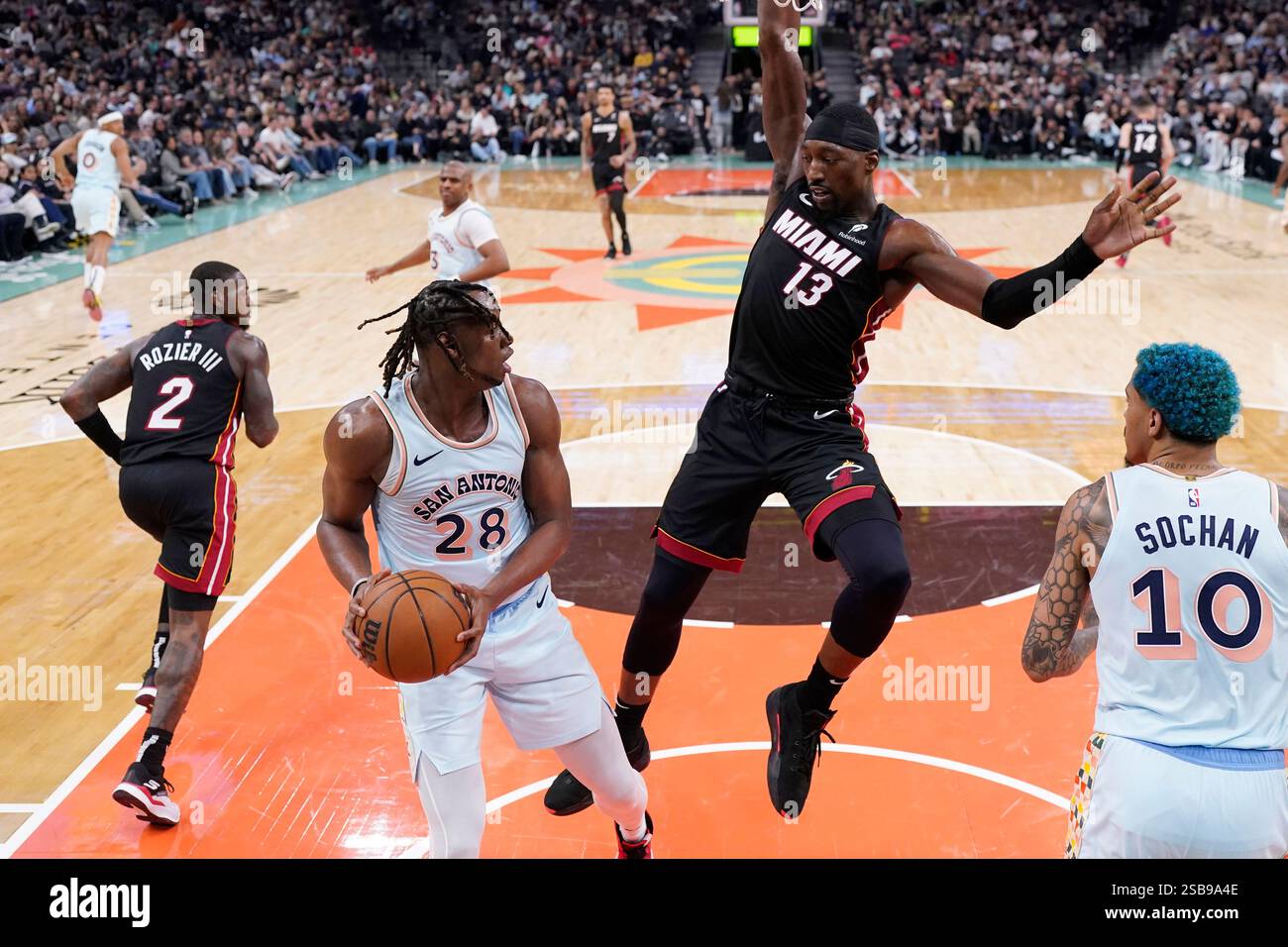 San Antonio Spurs center Charles Bassey (28) grabs a rebound in front ...