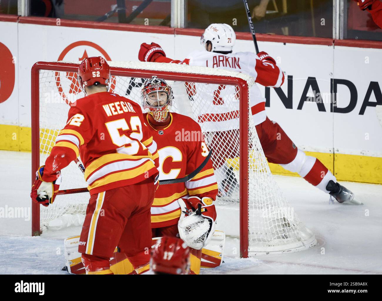 Detroit Red Wings' Dylan Larkin, right, celebrates his goal as Calgary ...