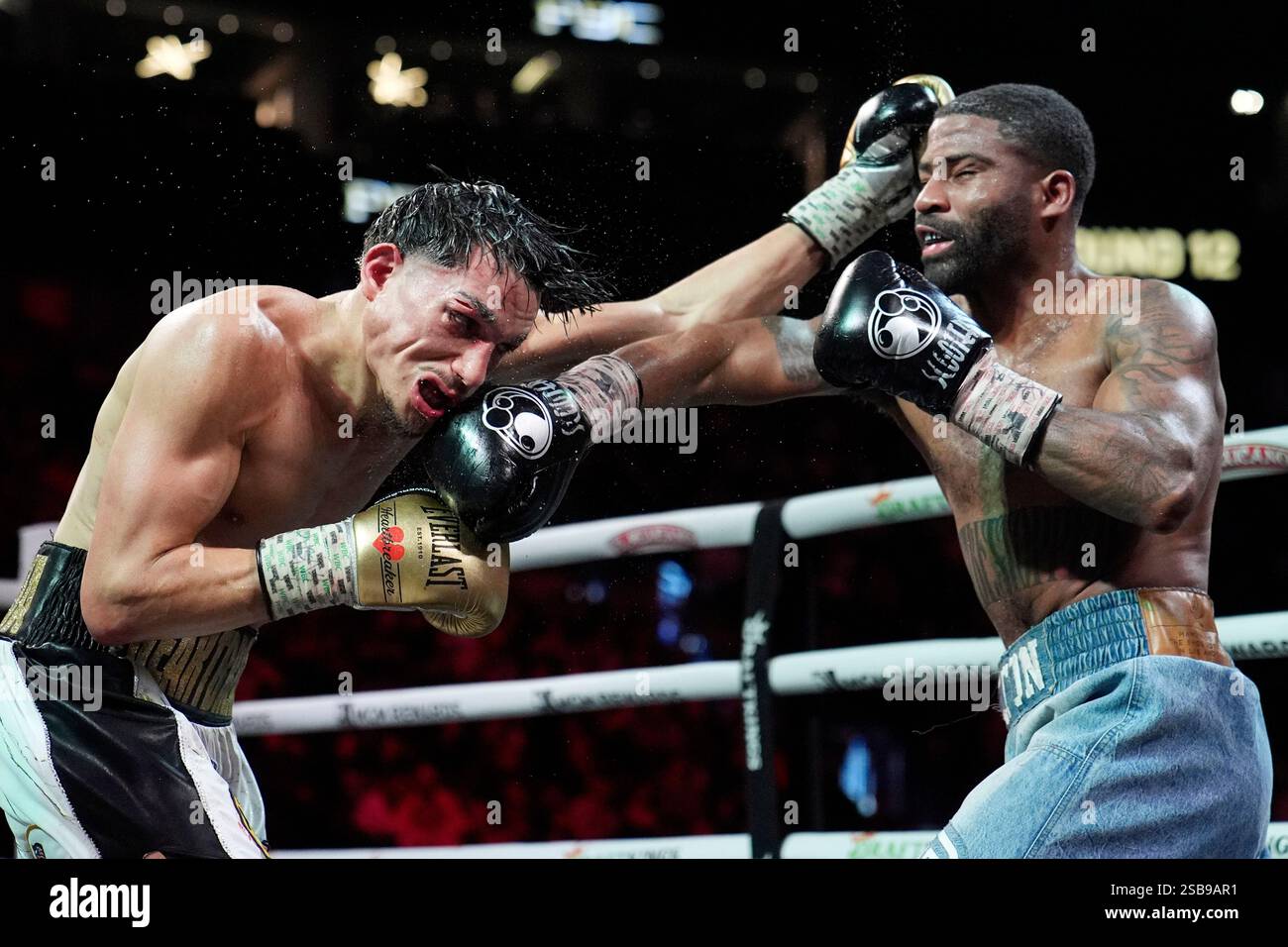 Brandon Figueroa, left, exchanges blows with Stephen Fulton Jr. in a ...