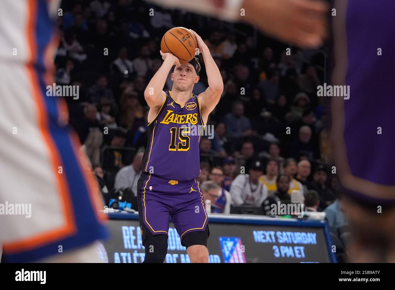 Los Angeles Lakers' Austin Reaves (15) shoots a three-point shot during ...