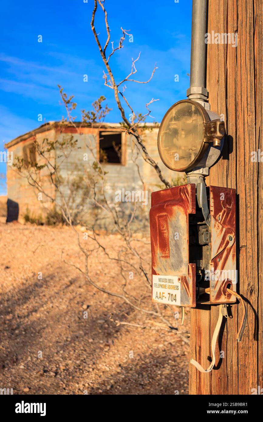 A rusted old electrical box with a label that reads "Bugs" on it. The ...