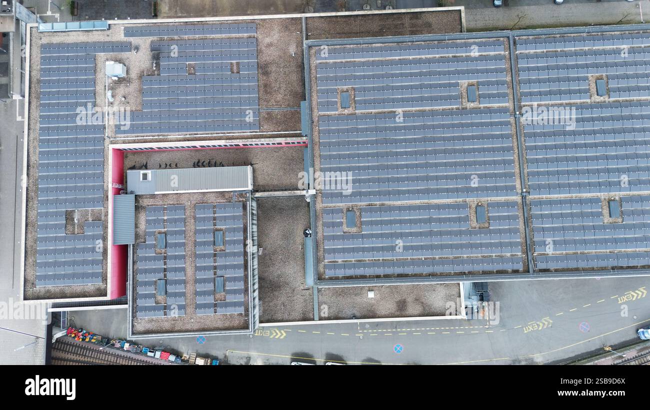 Top-down aerial view of large-scale solar panel installations on ...