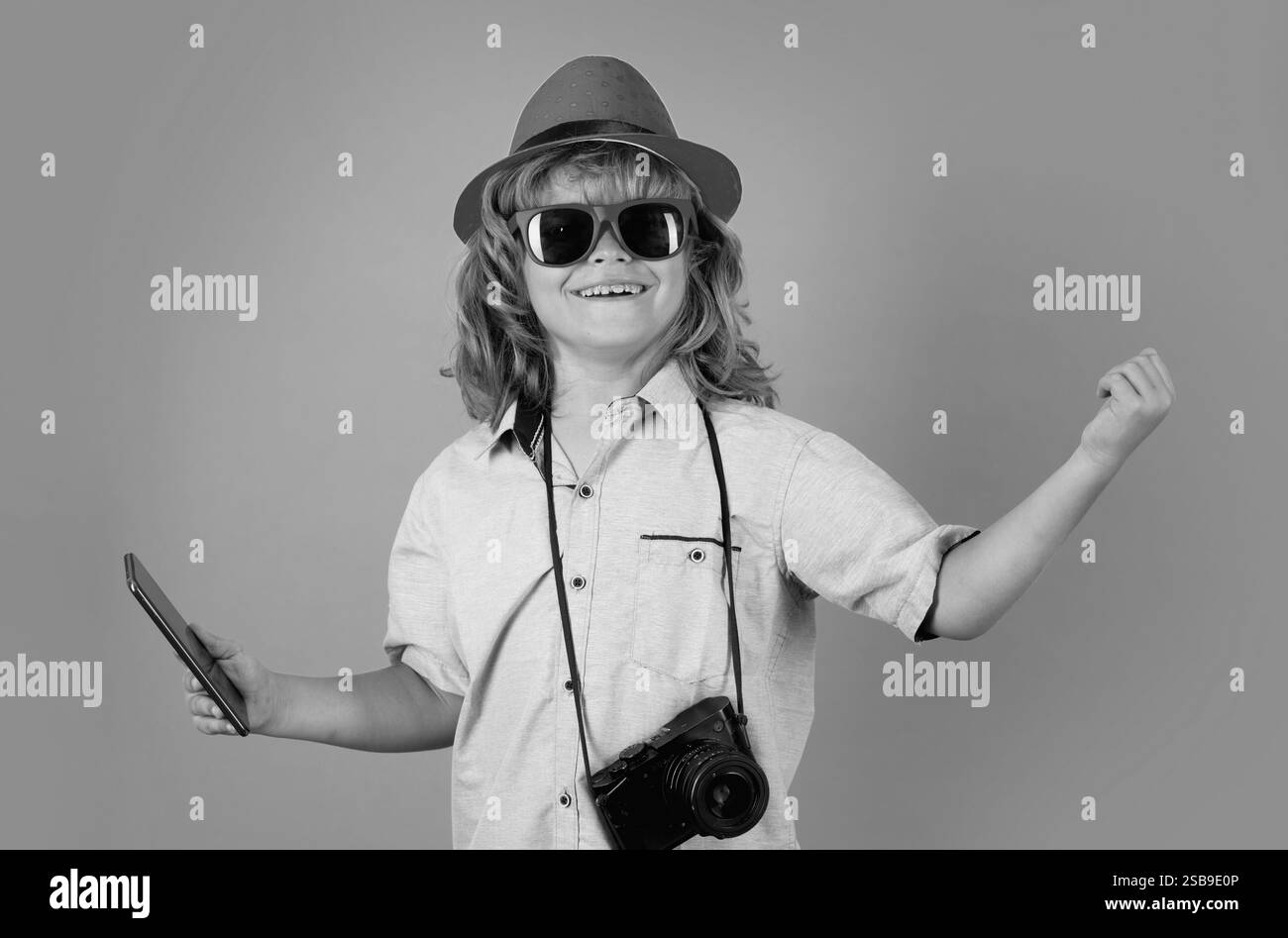 Kid blogger vlogger influencer using mobile phone. Adorable child ...