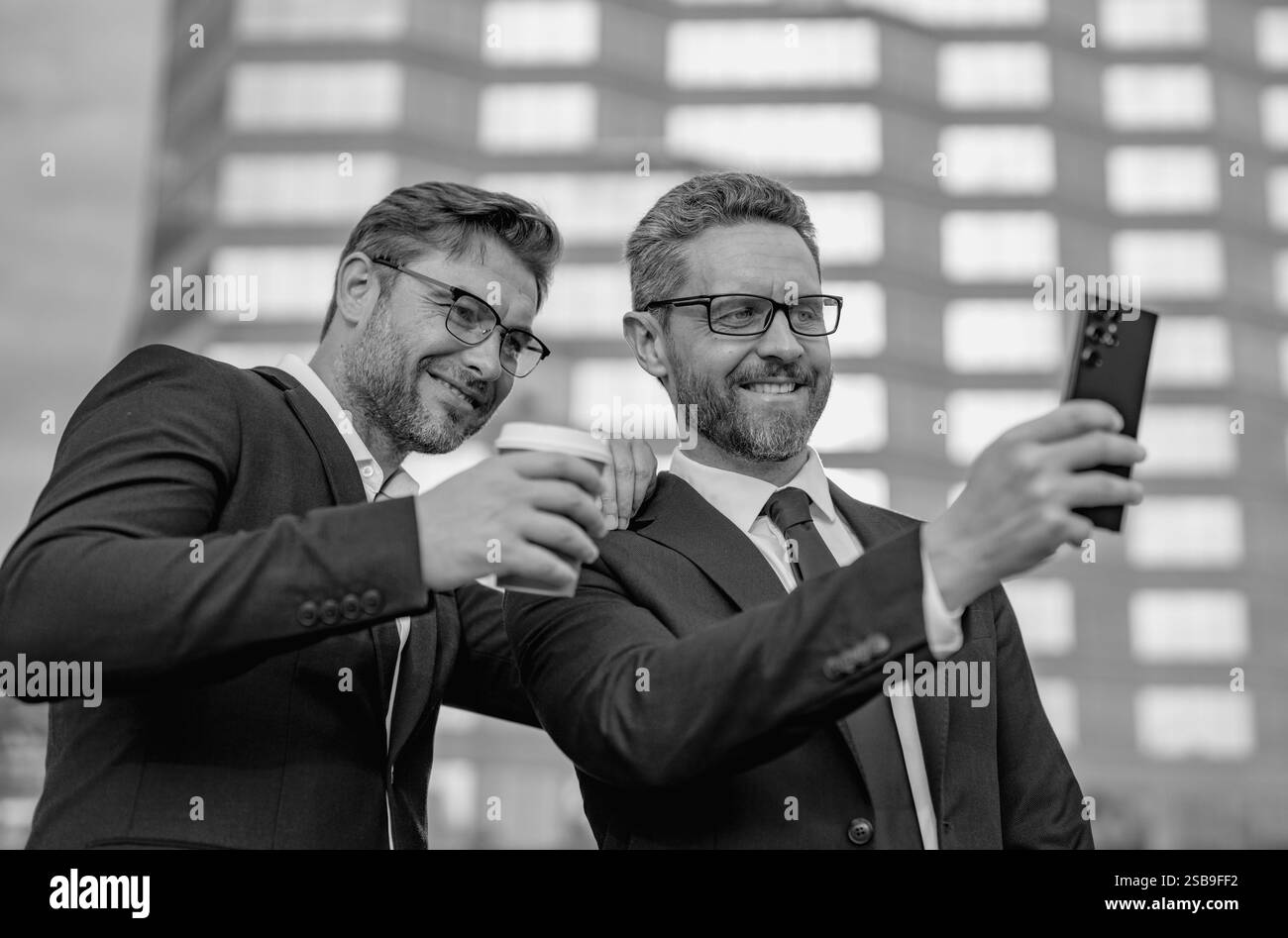 Two business men using phone outdoor. Planning of two business teams ...