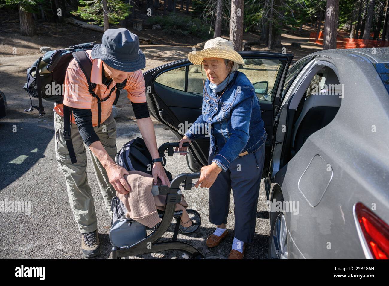Senior getting help with a bag hi-res stock photography and images - Alamy
